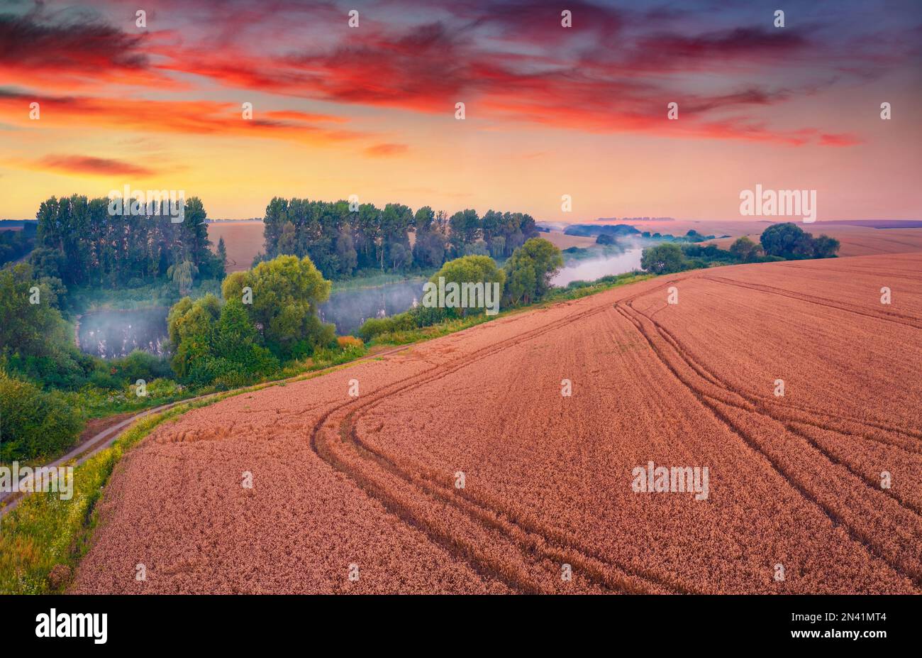 Misty summer sunset on outskirts of Ternopil town. Breathtaking morning ...