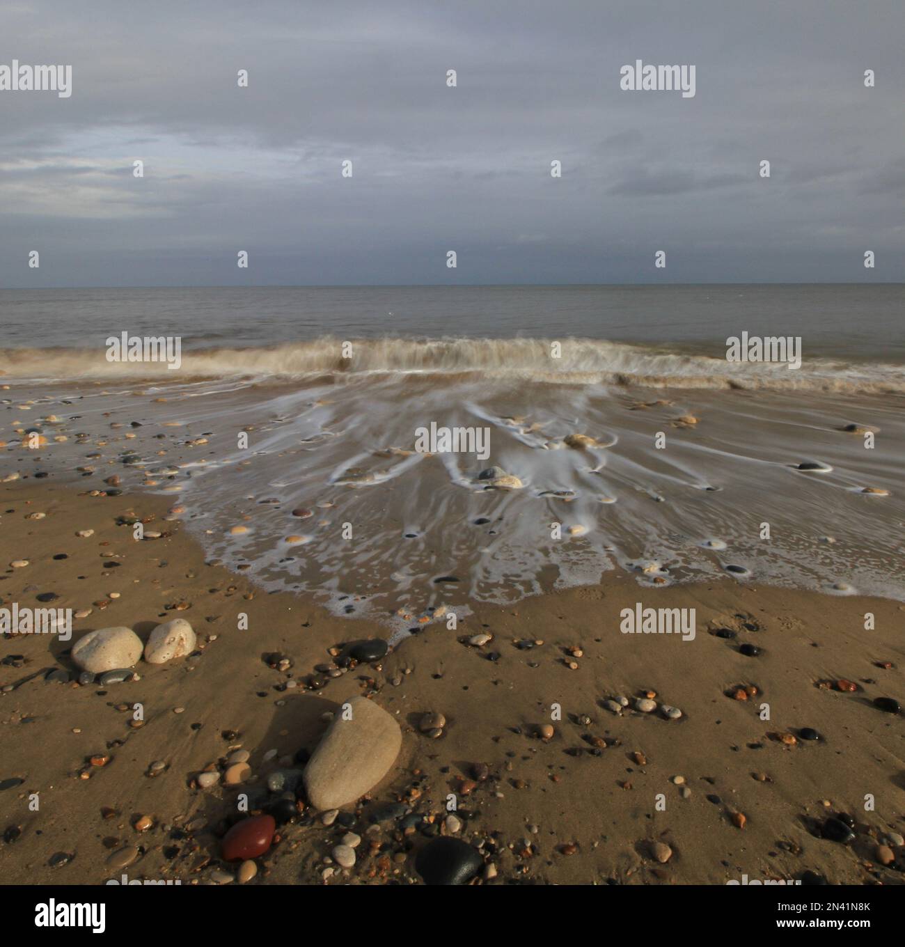Waves and pebbles on Seaham Beach Stock Photo - Alamy