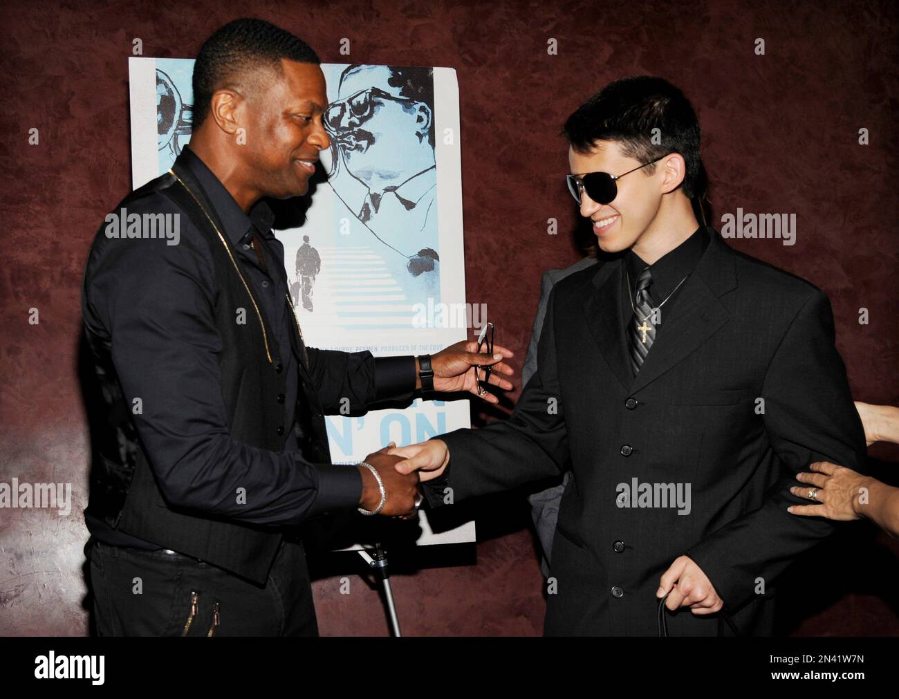 Actor Chris Tucker, left, greets Justin Kauflin, a subject of the ...