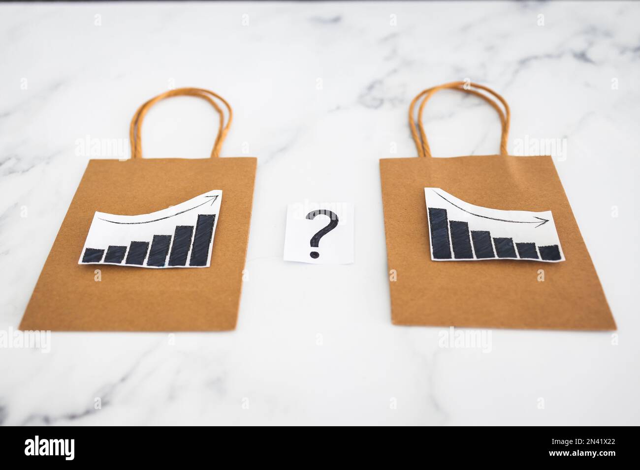 when will inflation go down. shopping bags with graph showing prices ...