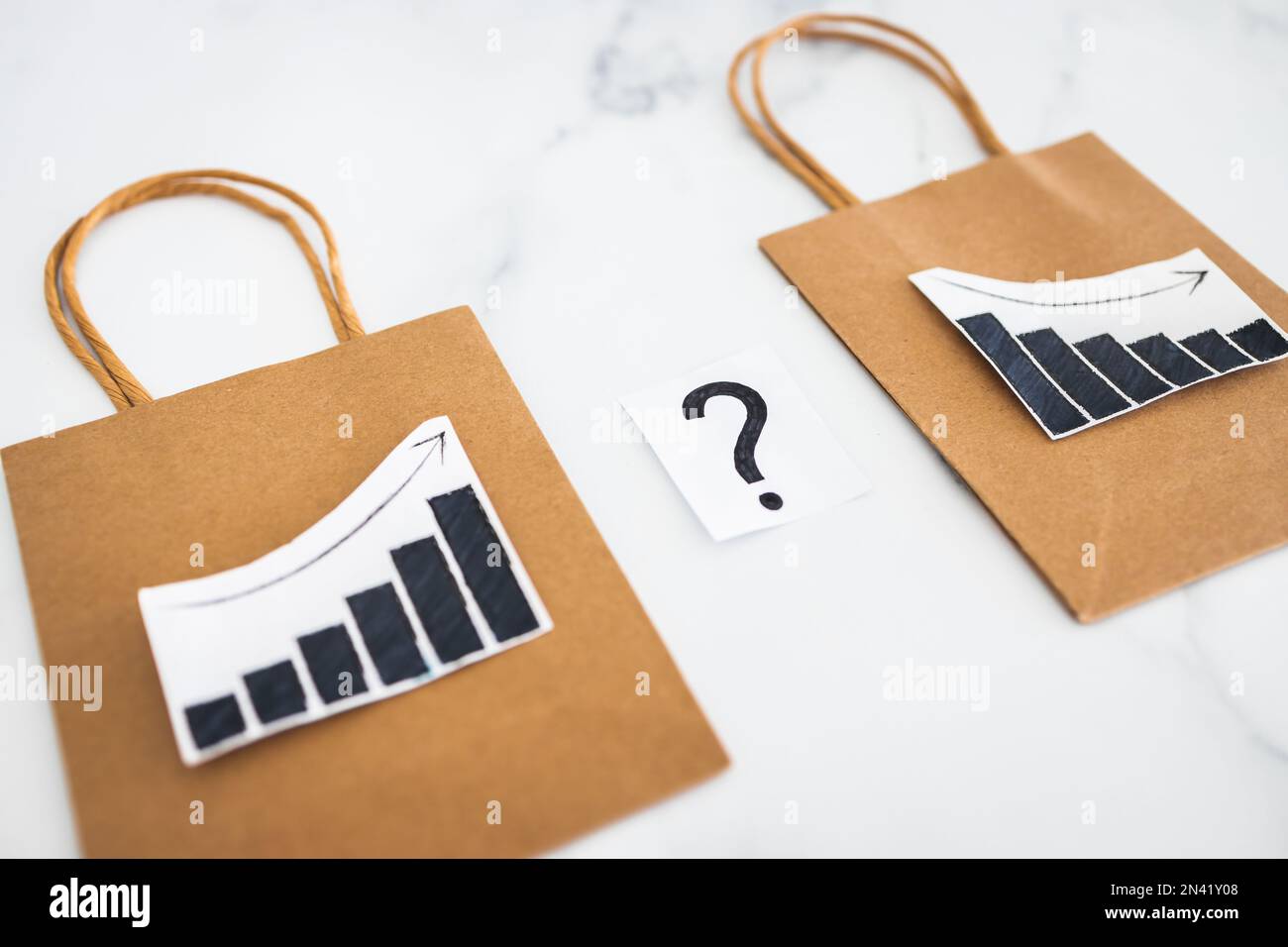 when will inflation go down. shopping bags with graph showing prices ...