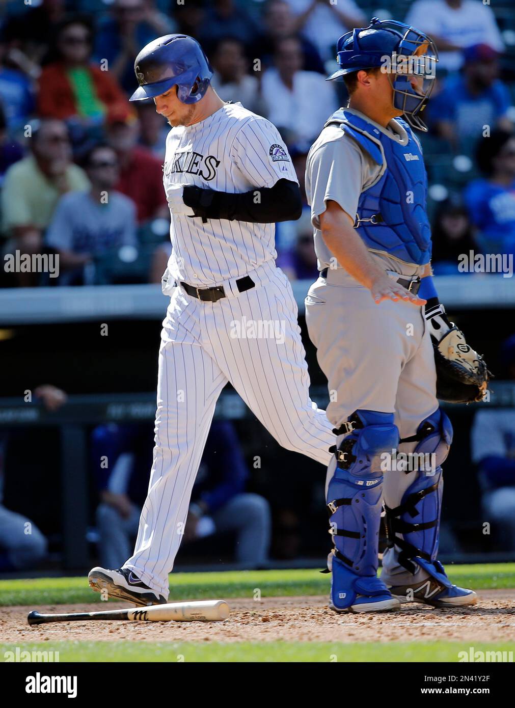 Colorado Rockies' Brandon Barnes (1) scores a run as Los Angeles ...
