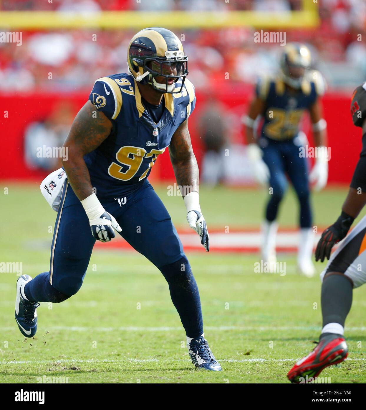 St. Louis Rams defensive end Eugene Sims (97) rushes the passer against ...