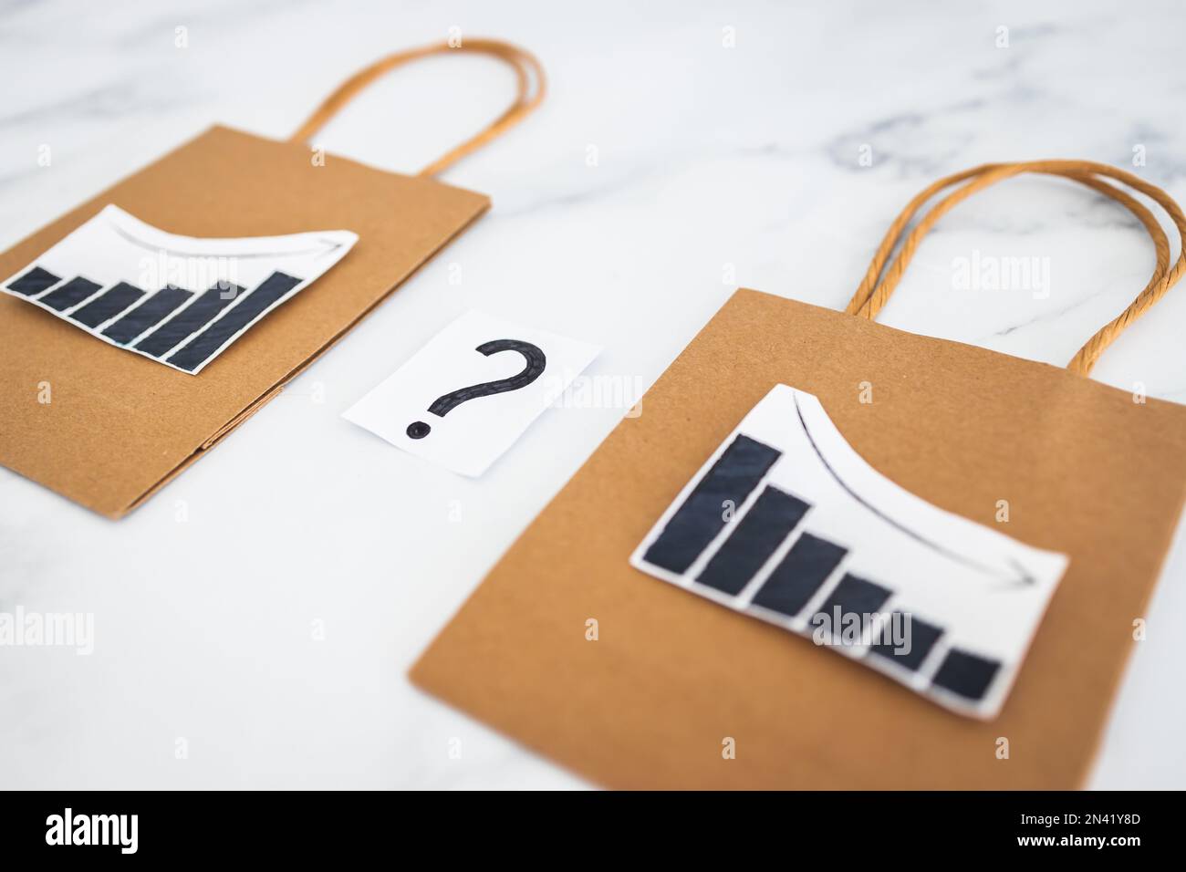 when will inflation go down. shopping bags with graph showing prices ...