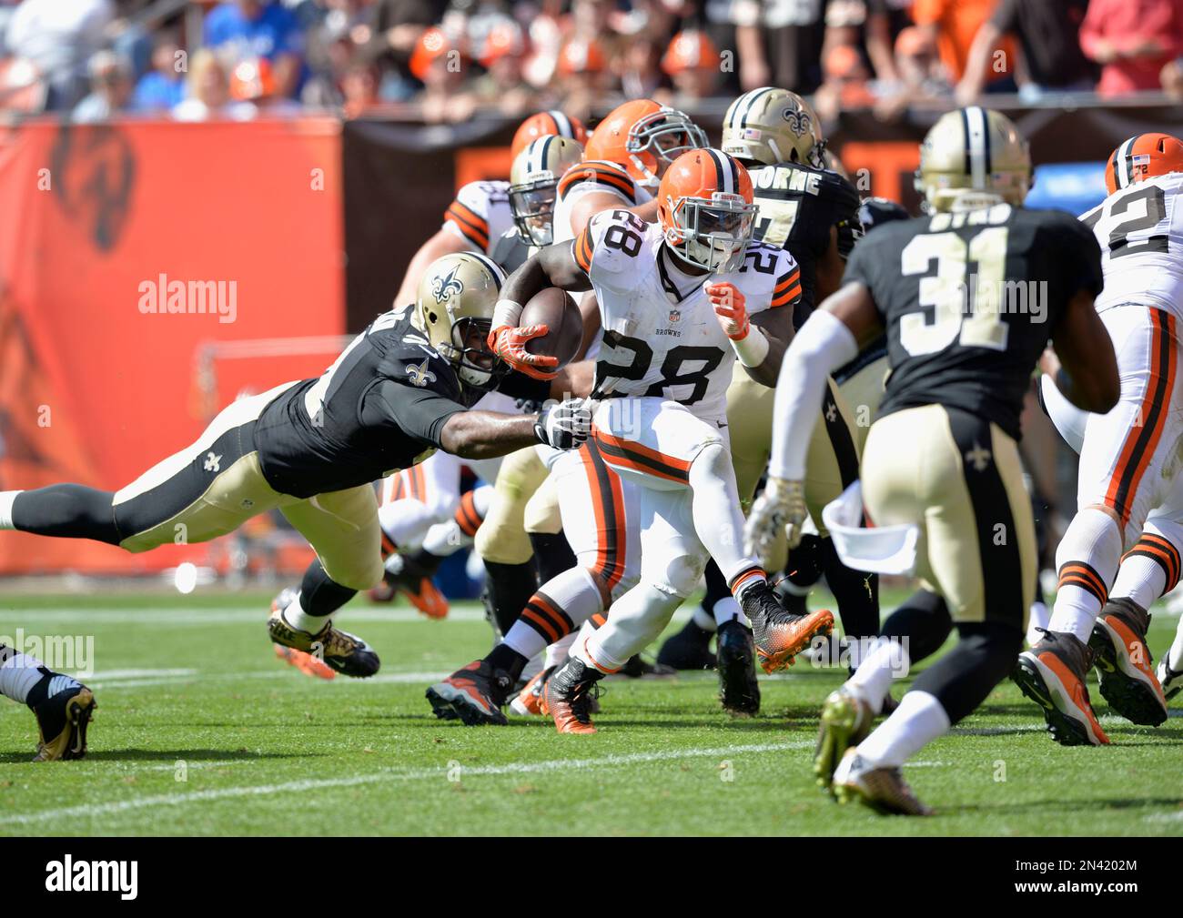 Cleveland Browns running back Terrance West (28) runs nine yards for a ...
