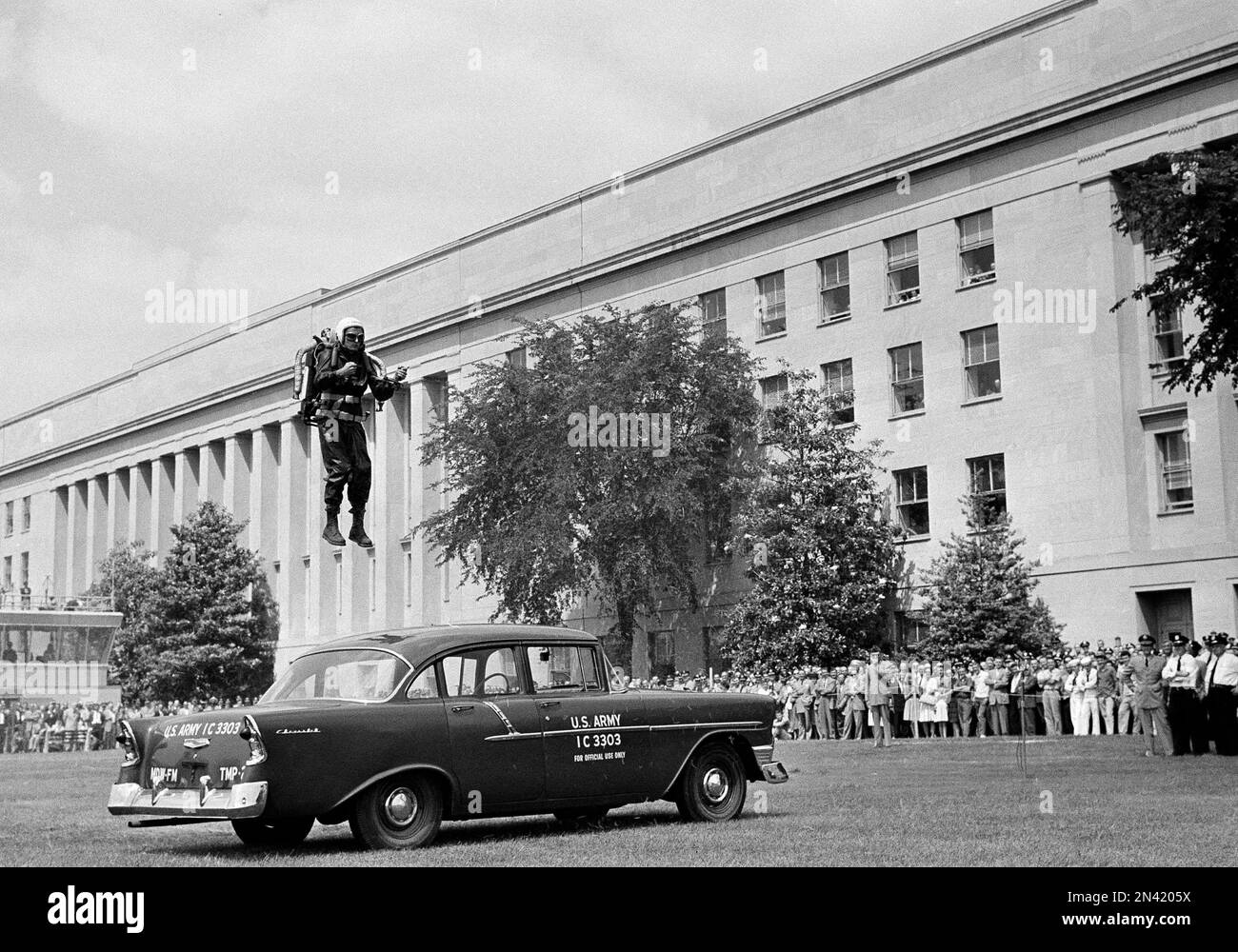 Engineer Harold Graham, of Buffalo, N.Y., glides over a parked car ...