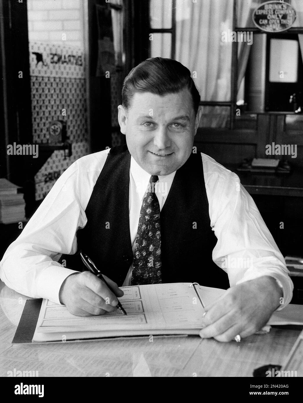 Joseph Doto, alias Joe Adonis, is shown leaving police headquarters for ...