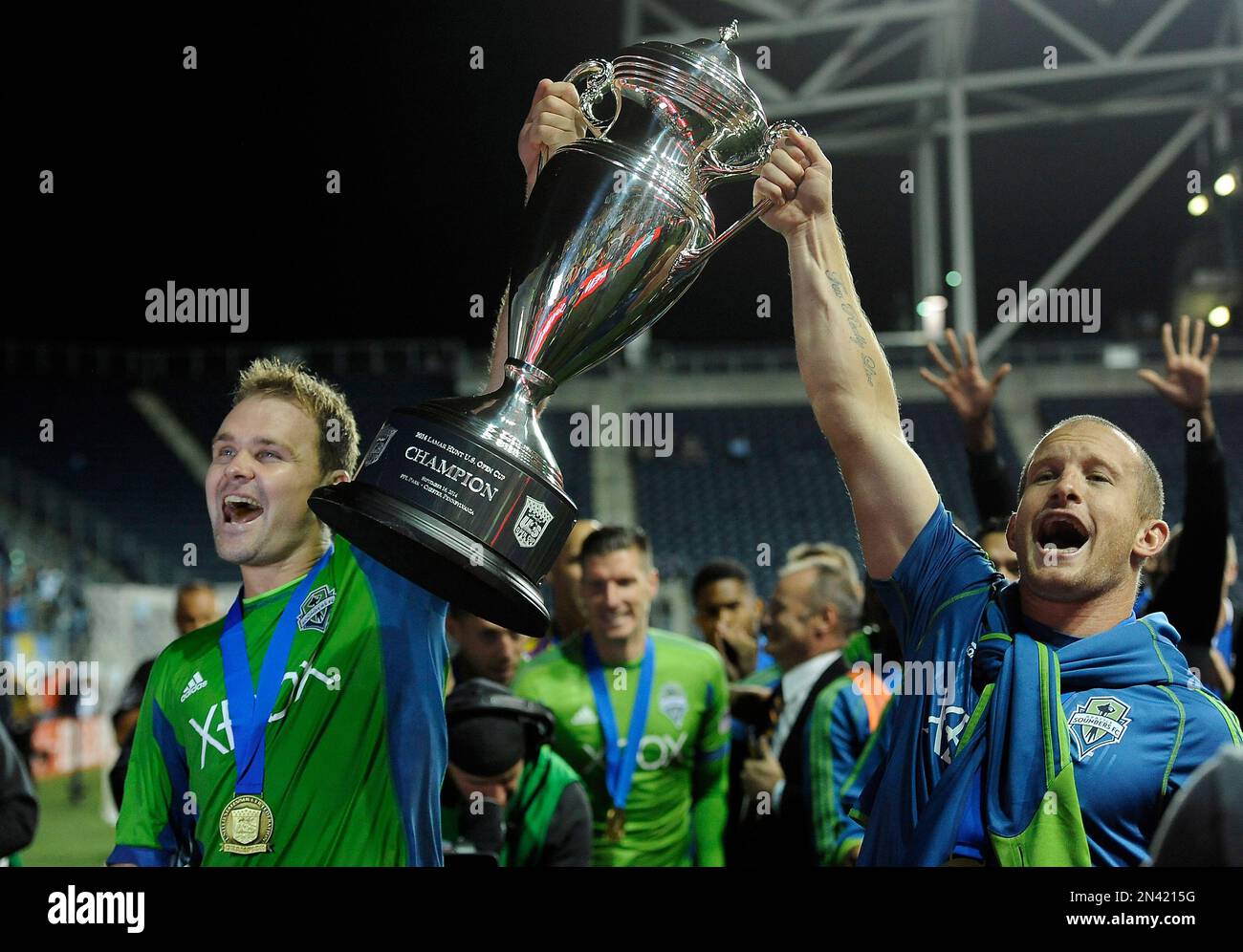 Seattle Sounders FC celebrate with the championship trophy at the end ...