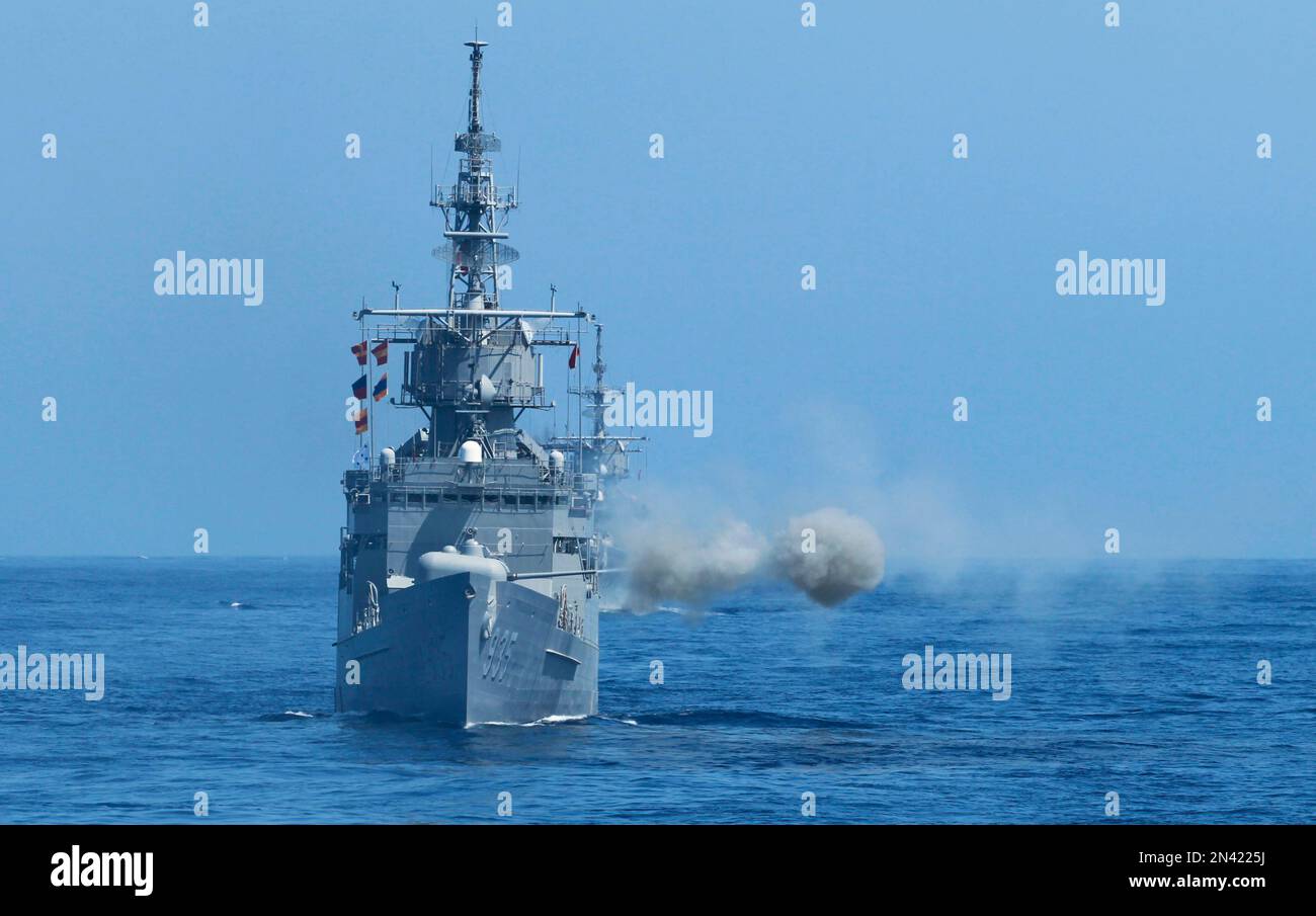 Taiwan Navy's Perry-class frigate fires its bow gun during the annual ...