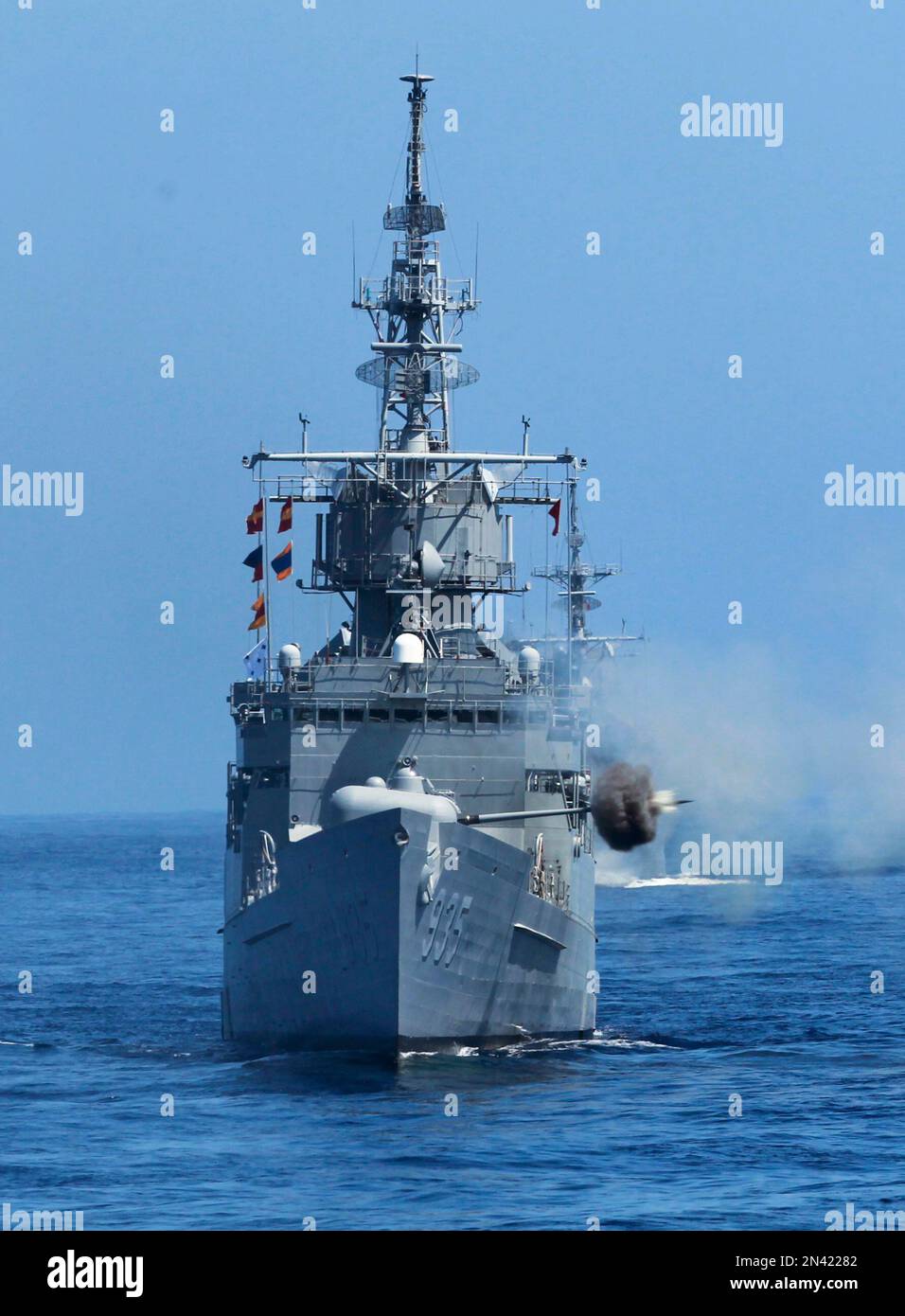 Taiwan Navy's Perry-class frigate fires its bow gun during the annual ...