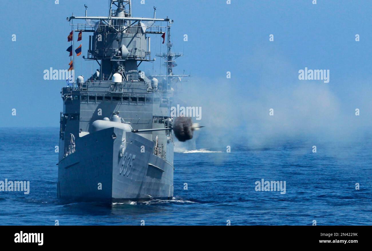 Taiwan Navy's Perry-class frigate fires its bow gun during the annual ...