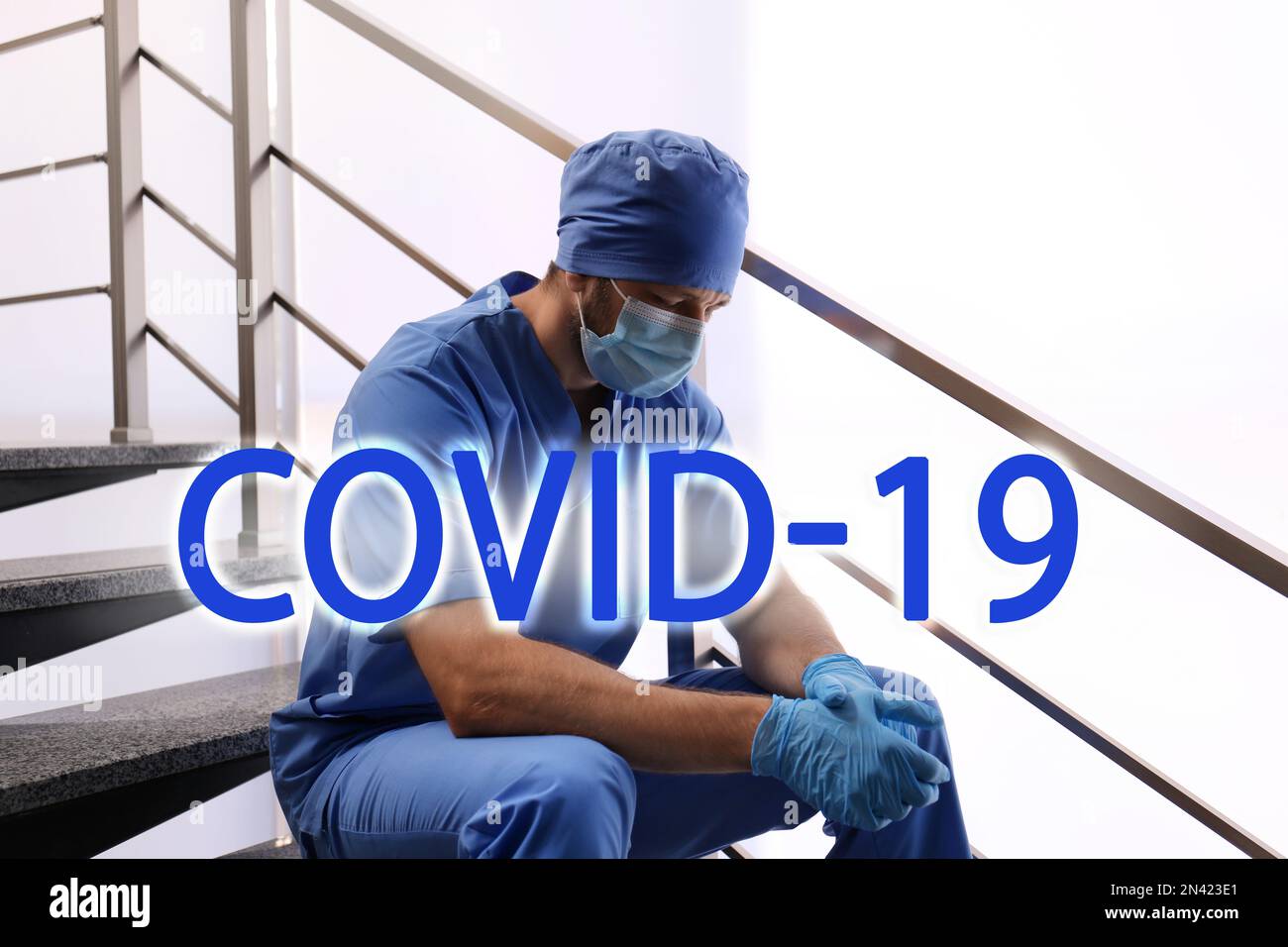 Tired overwhelmed doctor sitting on stairs in hospital. Medical system ...