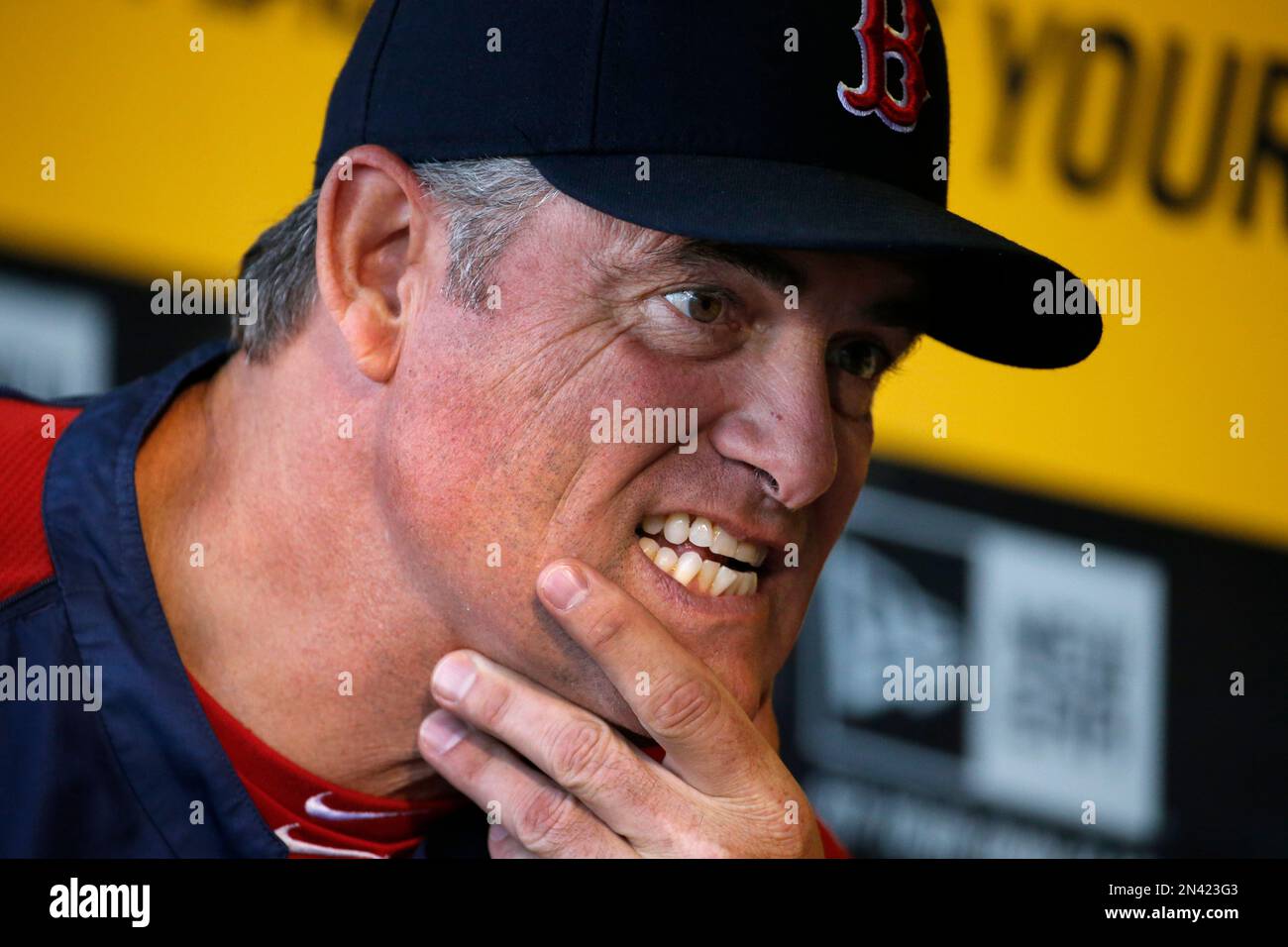 Boston Red Sox manager John Farrell looks at the lineup on the dugout ...