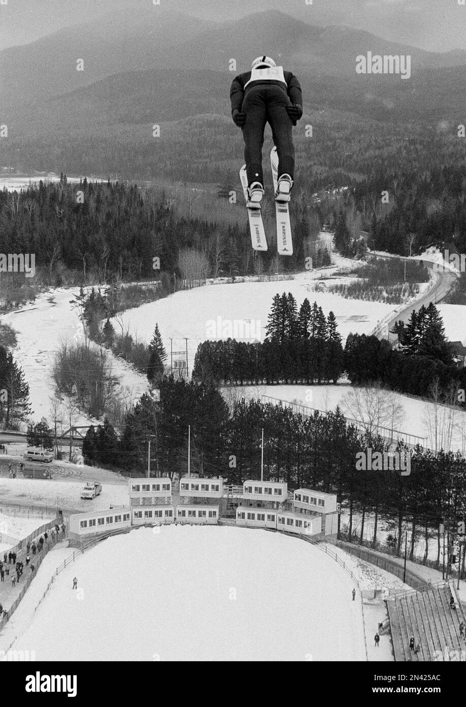 An unidentified ski jumper is airborne while flying down the Intervale ...