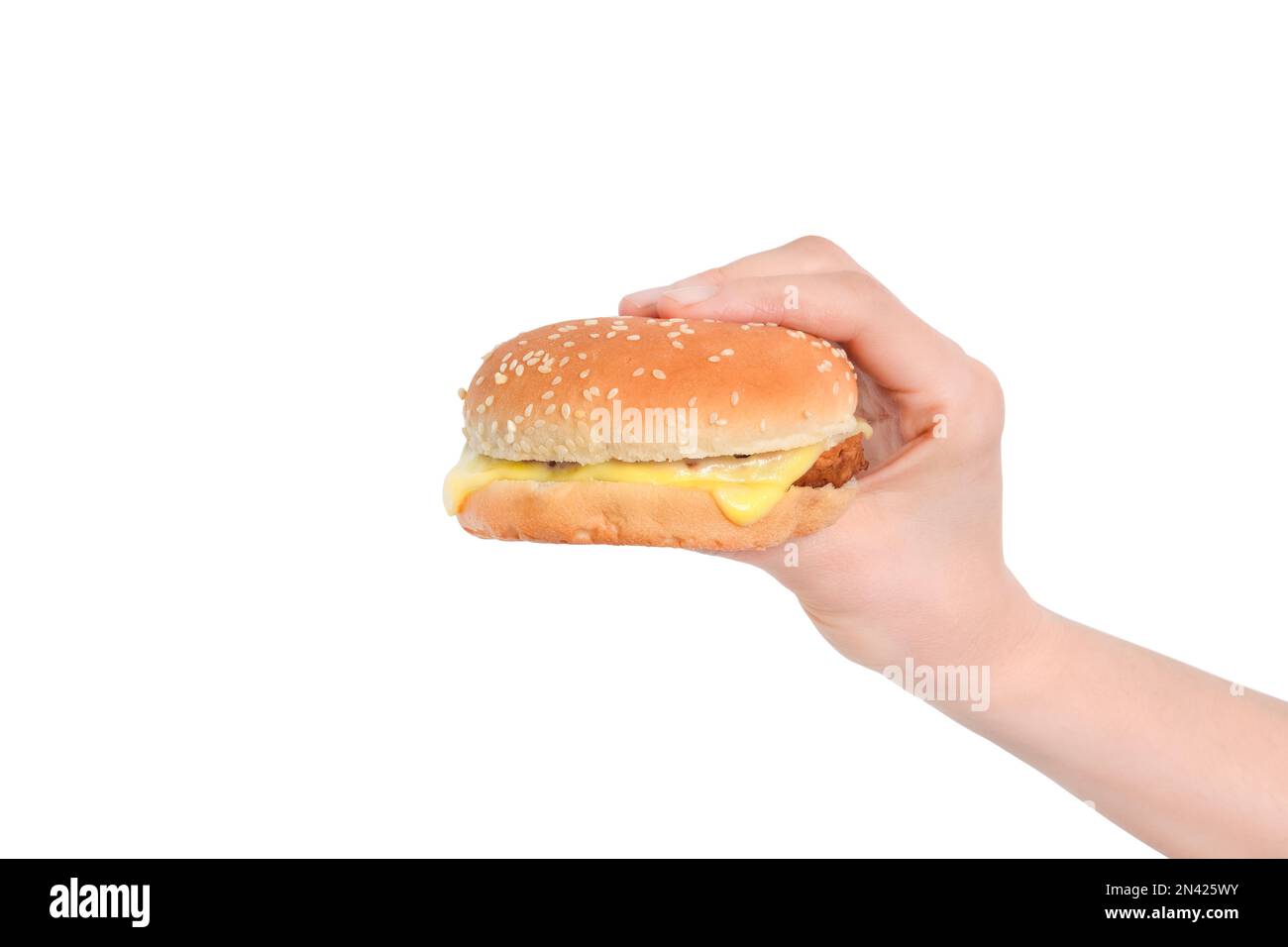Hand holds big cheeseburger isolated on white background close-up ...