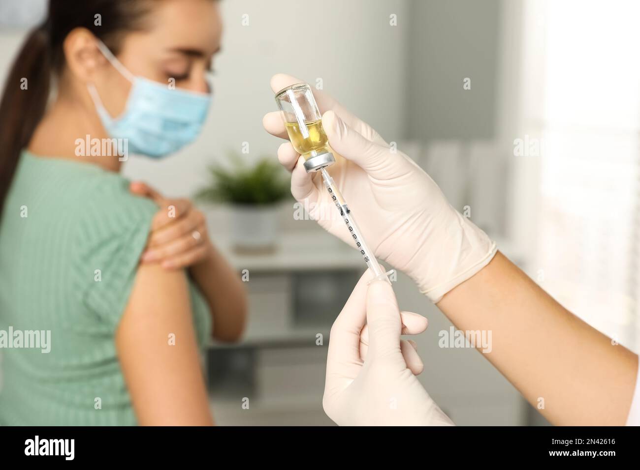 Doctor giving injection to patient in hospital, closeup. Vaccination ...