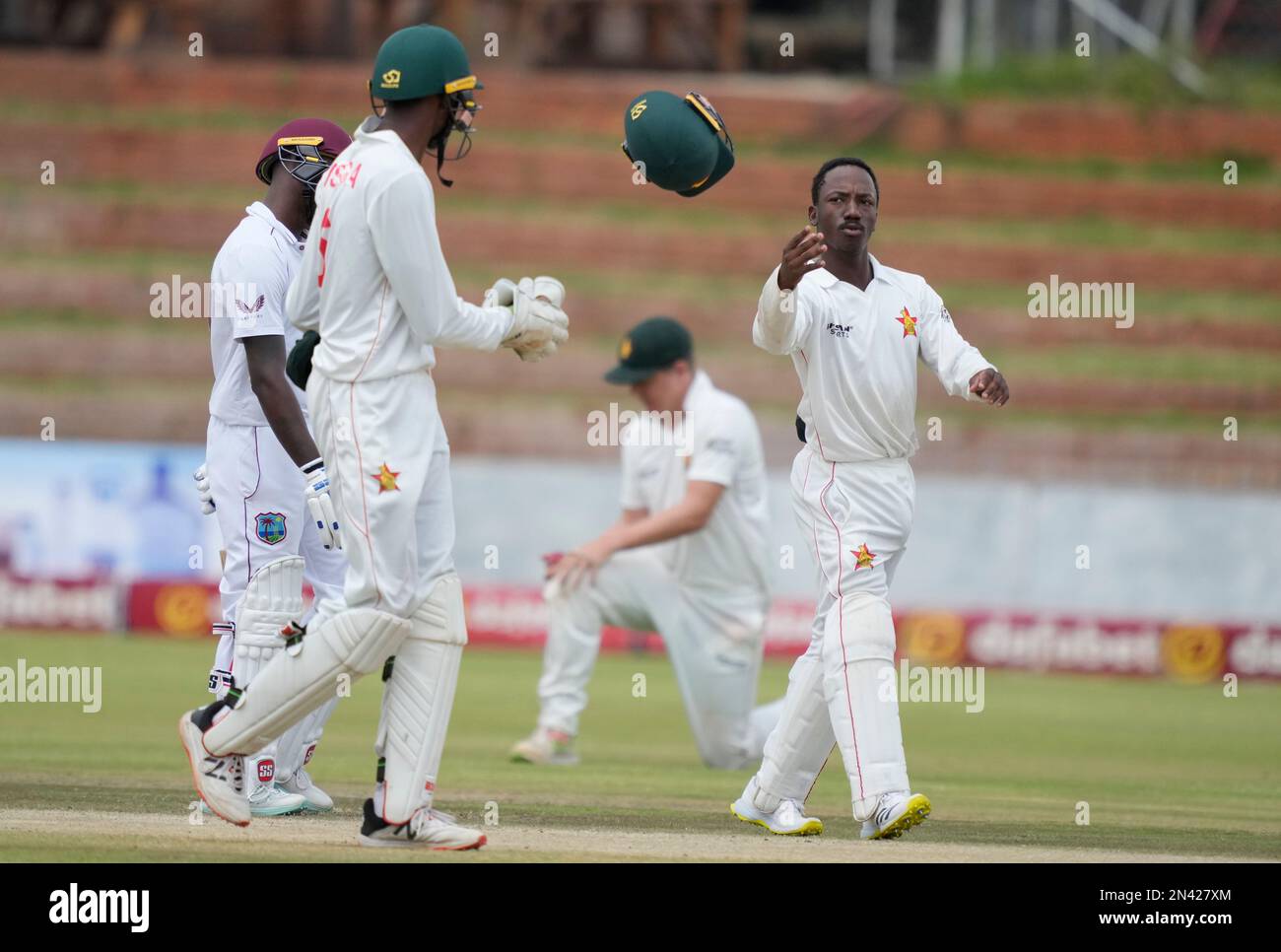 Zimbabwean players are seen on the pitch on the final day of the first ...