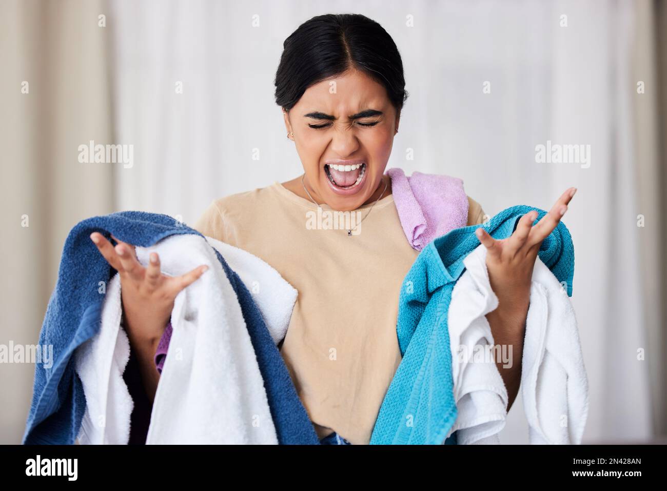 Laundry, frustrated and woman with anger, screaming and overworked with ...