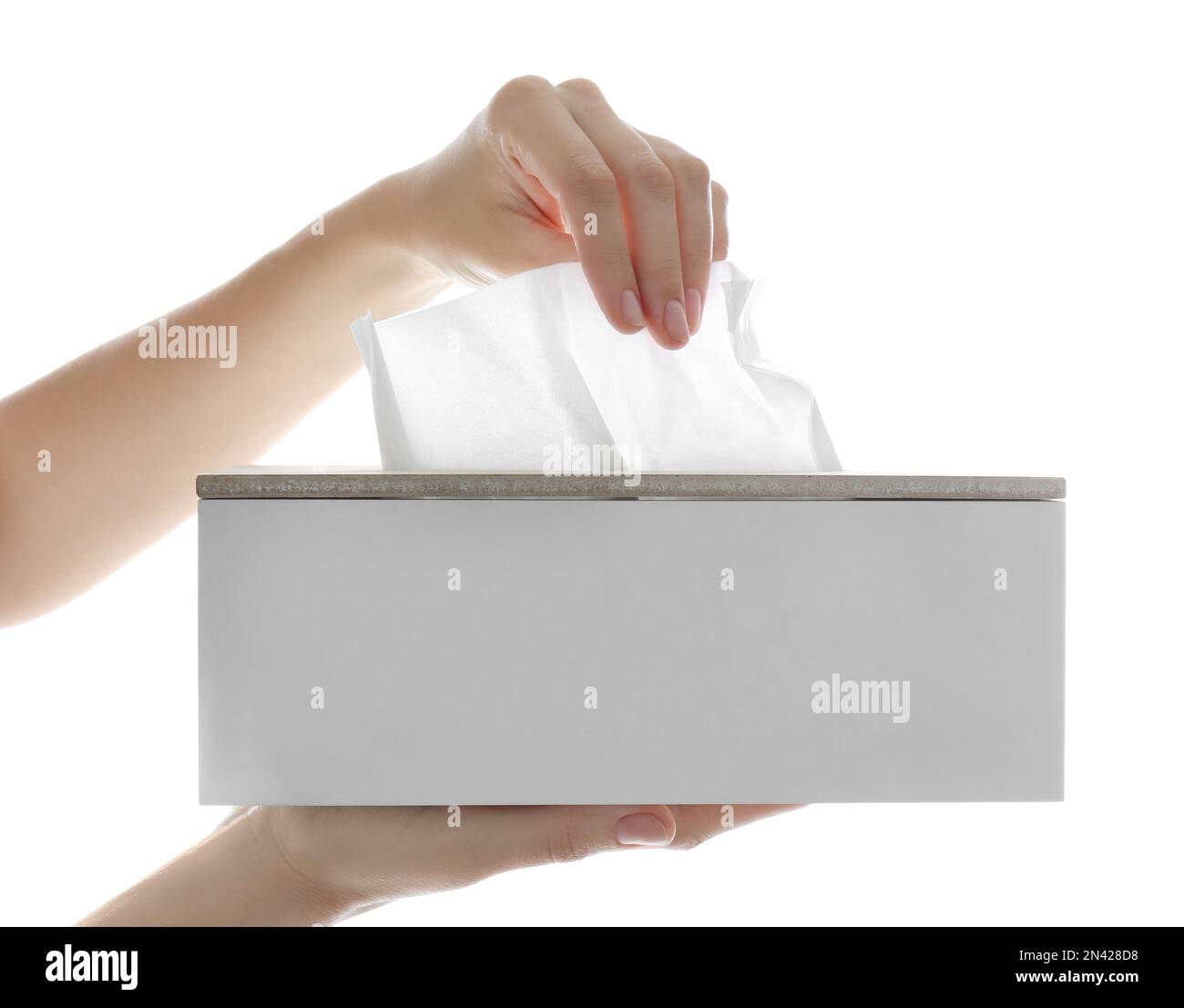 Woman taking paper tissue from holder on white background, closeup ...