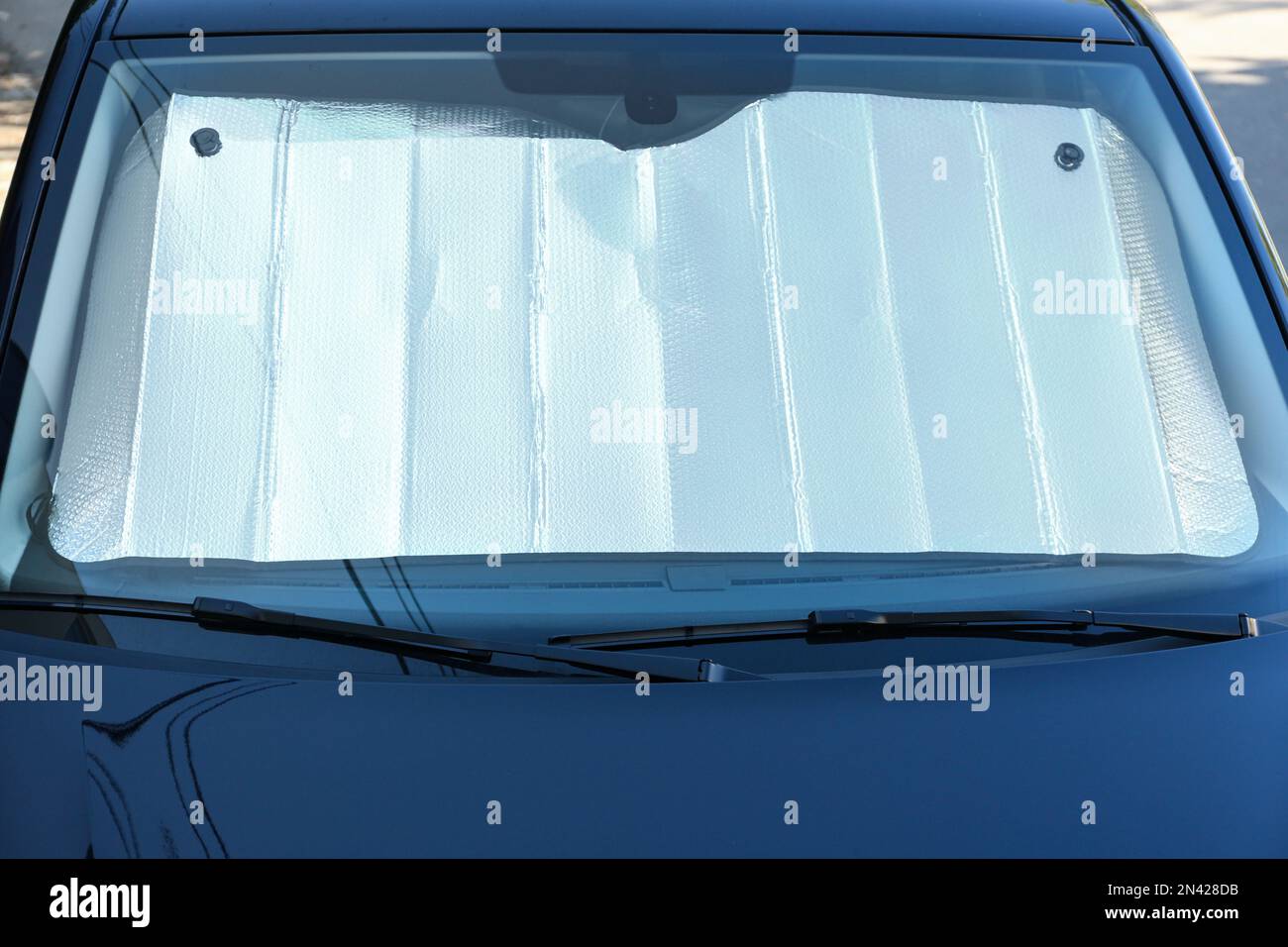 Sun shade under windshield inside car, closeup. Heat protection Stock ...