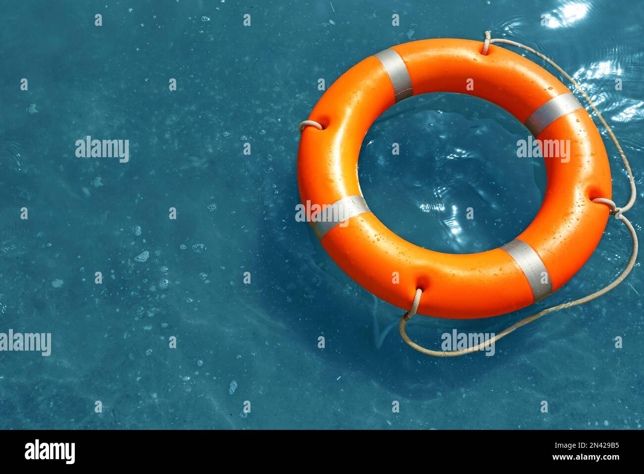 Orange life buoy floating in sea, above view. Emergency rescue ...