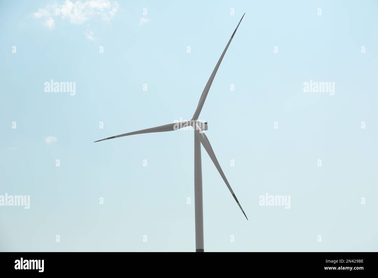 Modern wind turbines against blue sky. Energy efficiency Stock Photo ...