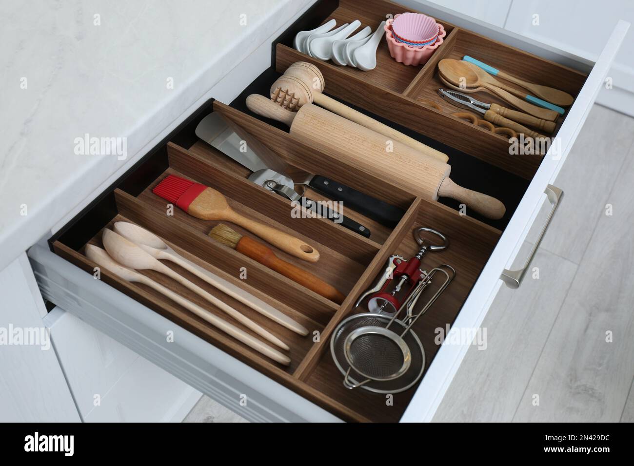 Open drawer with utensil set indoors. Order in kitchen Stock Photo - Alamy