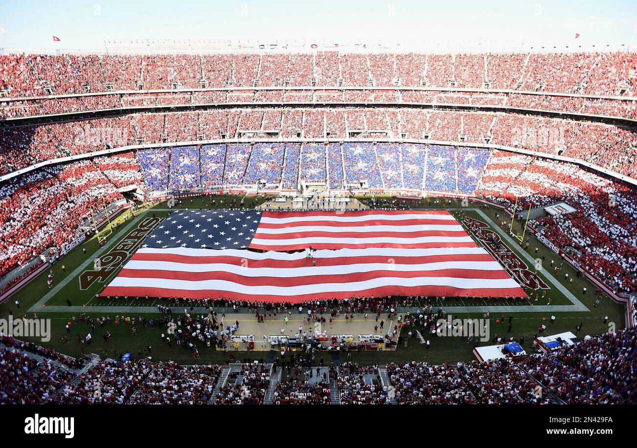 A flag is presented on the Levi's Stadium field before an NFL football ...