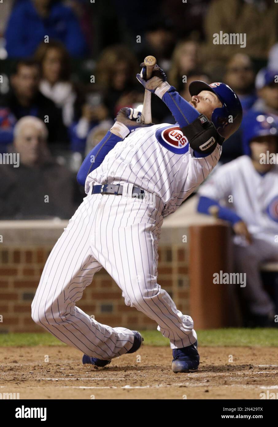 Chicago Cubs' Travis Wood backs away from a high and inside pitch from ...