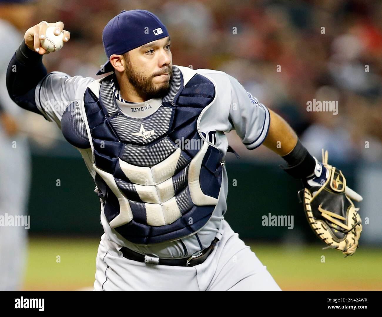 San Diego Padres' catcher Rene Rivera throws down to first base in ...