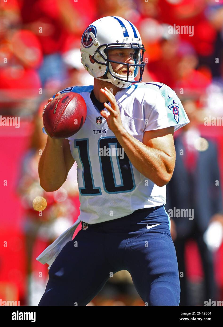 Tennessee Titans Jake Locker (10) drops back to pass during an NFL game ...