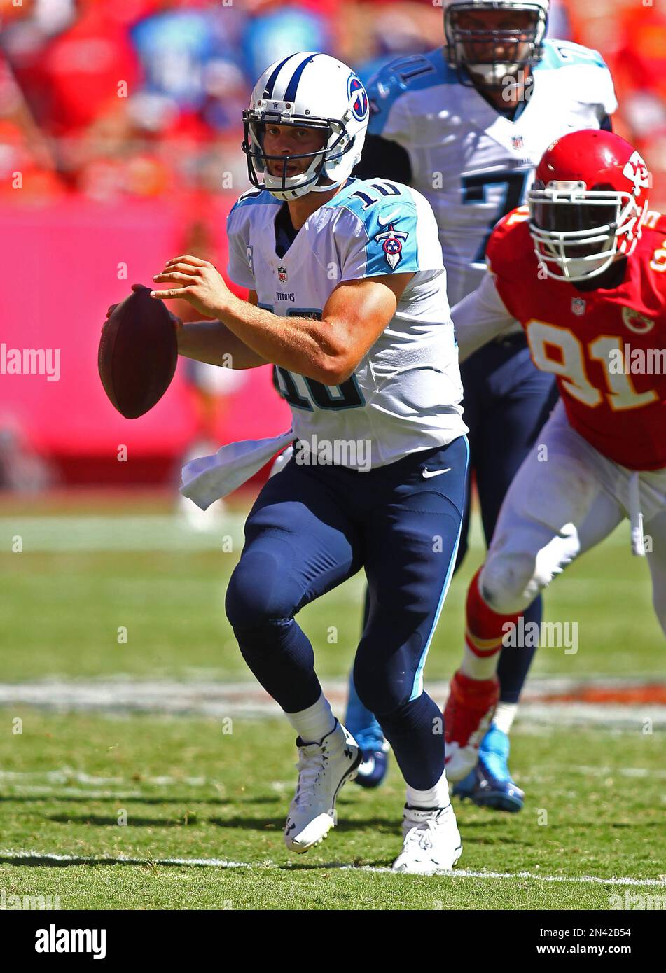 Tennessee Titans Jake Locker (10) scrambles during an NFL game against ...