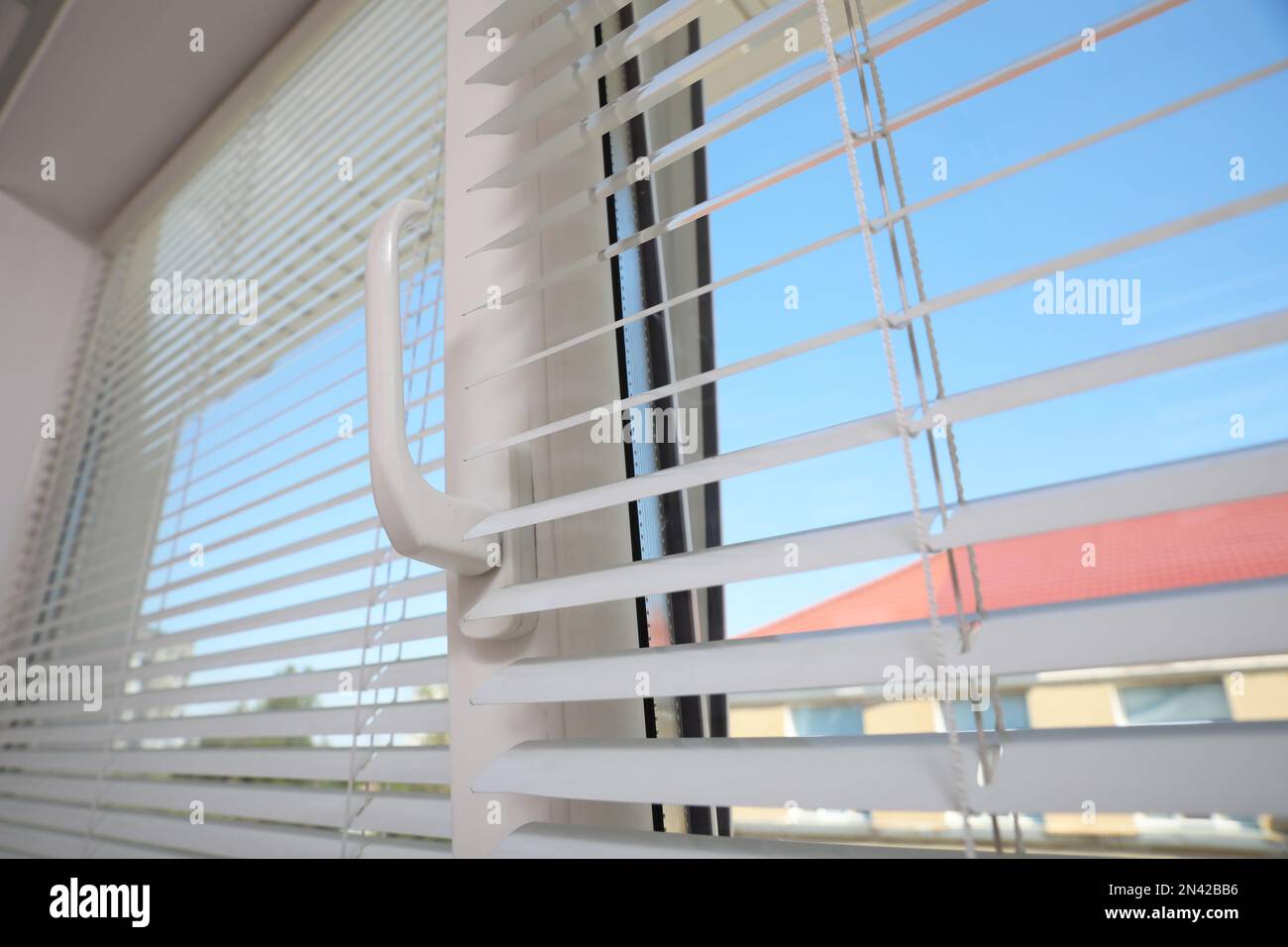 Closeup view of plastic window with blinds Stock Photo - Alamy