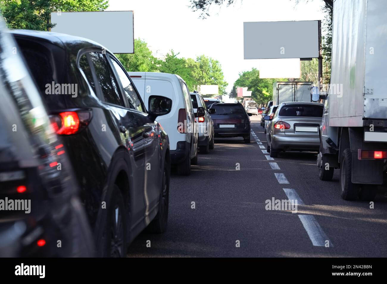 Cars in traffic jam on city street Stock Photo - Alamy