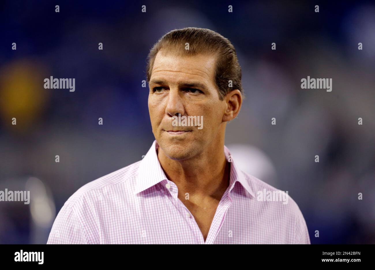 Baltimore Ravens owner Steve Bisciotti walks on the field before an NFL ...