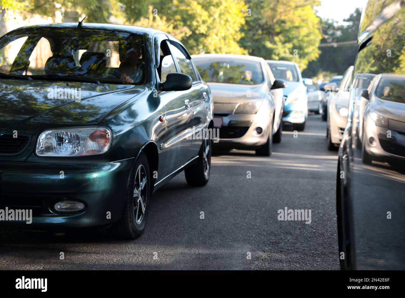 Cars in traffic jam on city street Stock Photo - Alamy