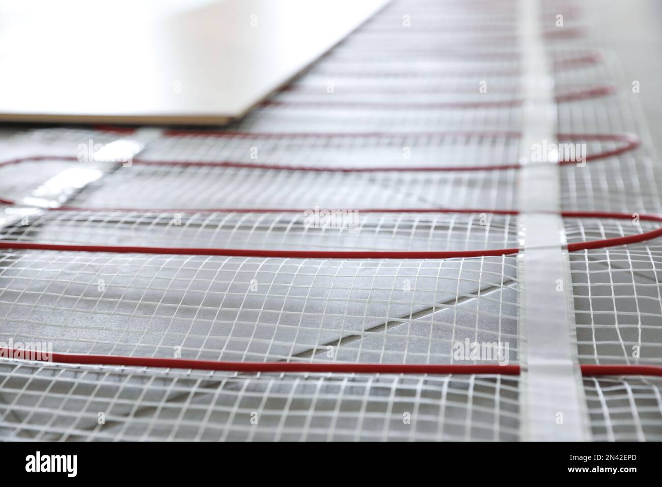Installation of modern underfloor trace heating system indoors, closeup Stock Photo - Alamy