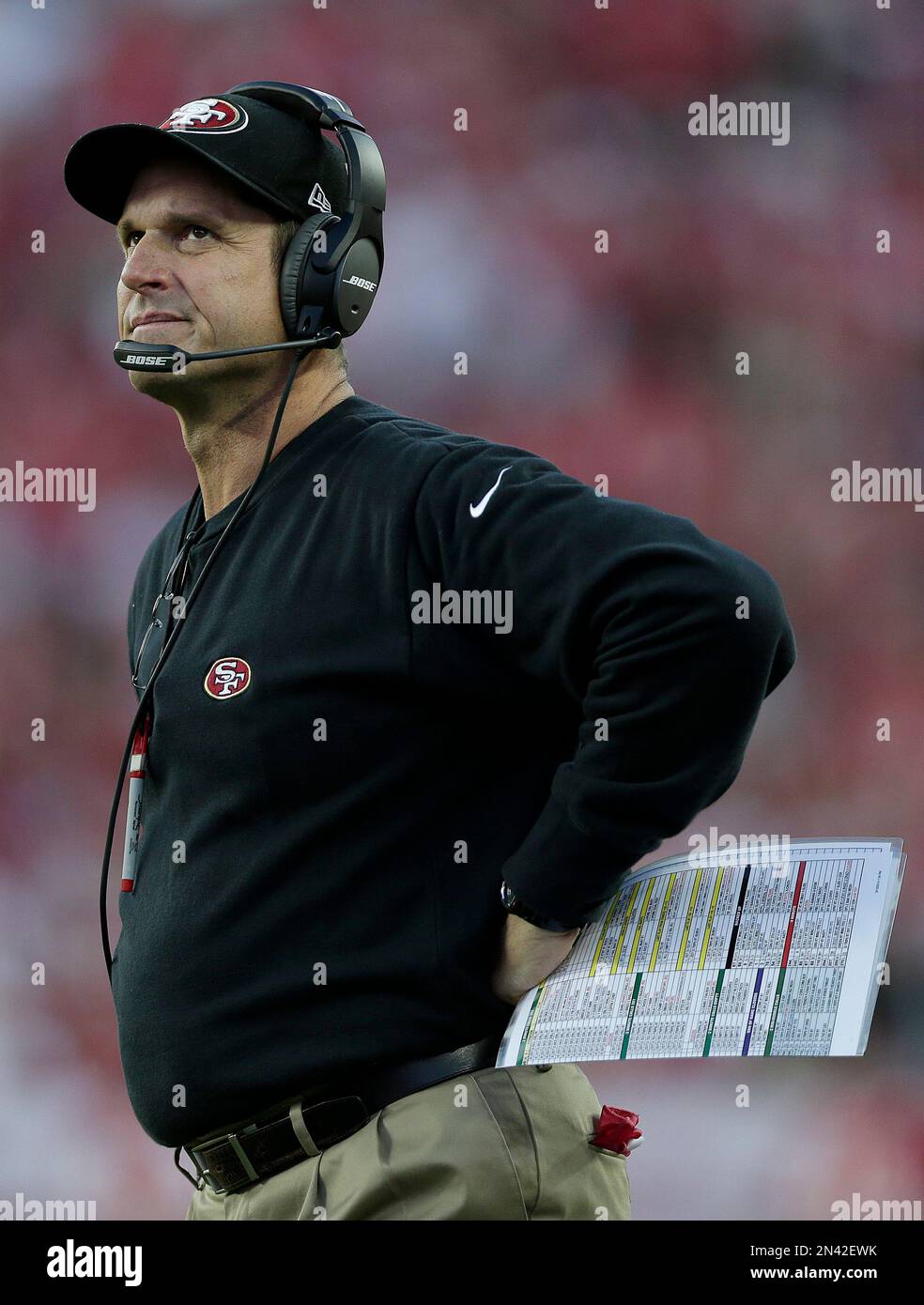 San Francisco 49ers head coach Jim Harbaugh stands on the sideline ...