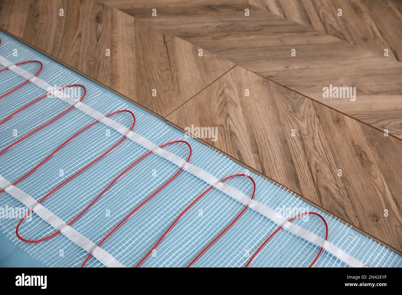 Installation of modern underfloor trace heating system indoors Stock ...