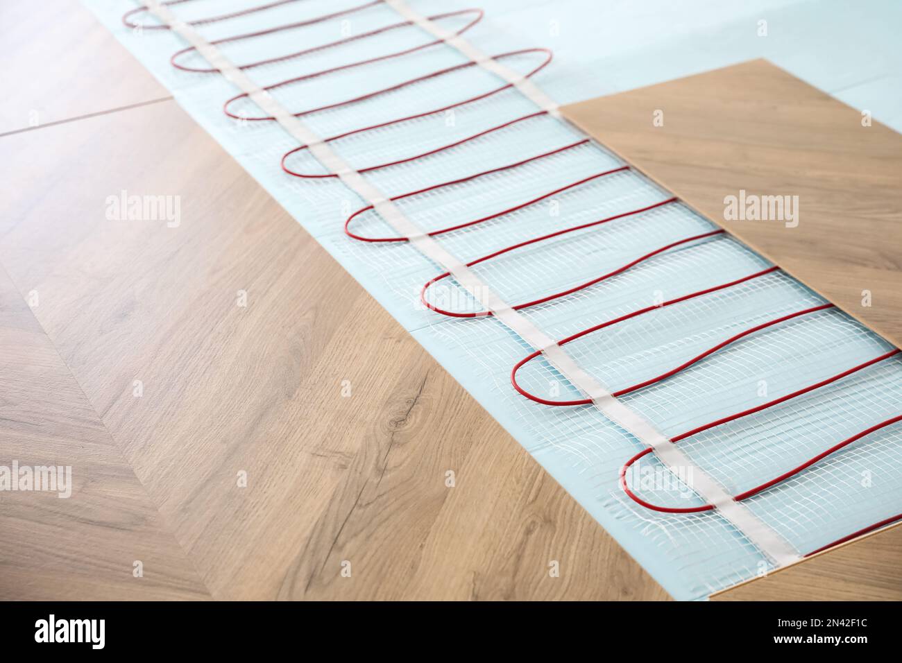 Installation of modern underfloor trace heating system indoors Stock ...