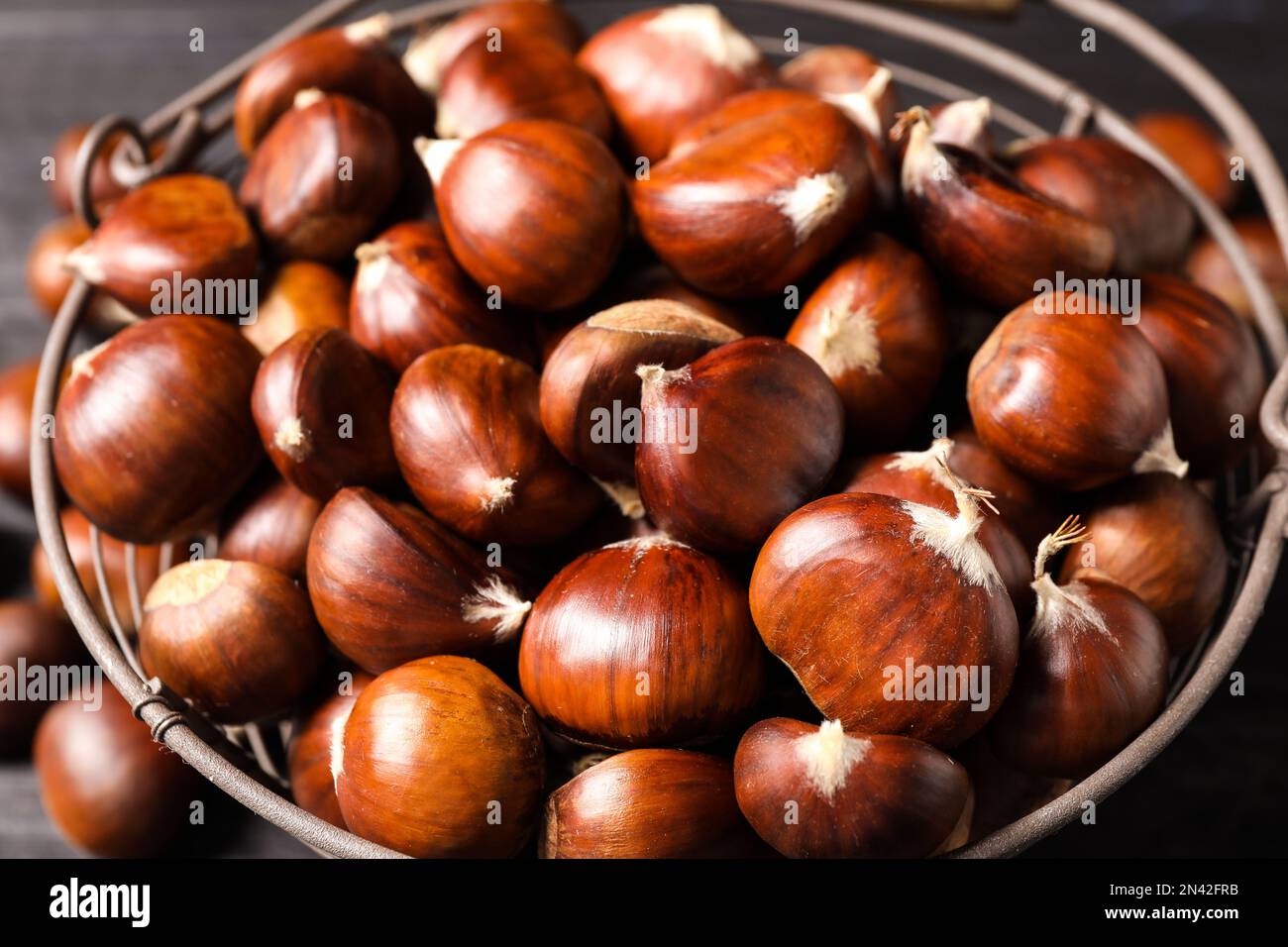 Fresh sweet edible chestnuts in basket, closeup Stock Photo - Alamy