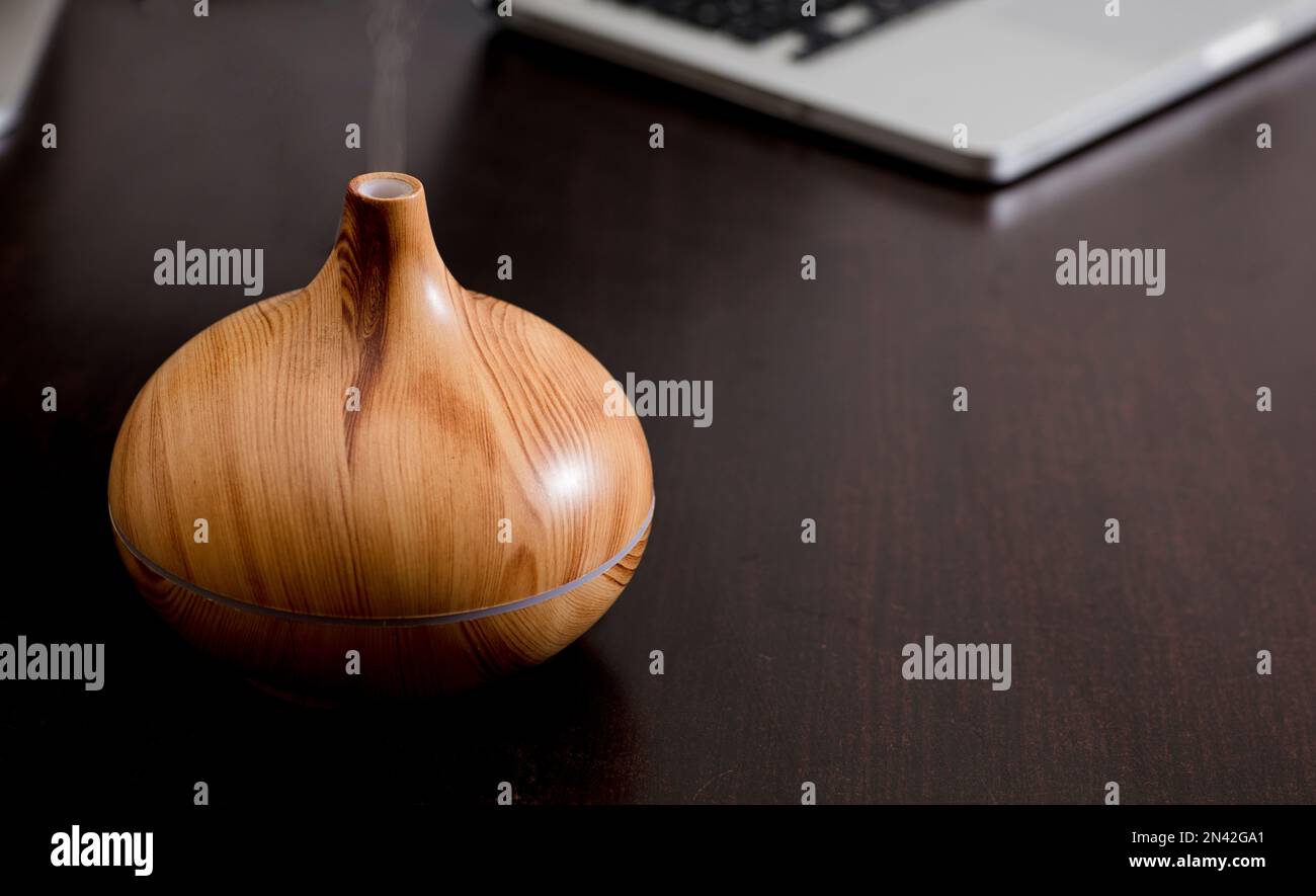 wood fragrance on desk table with steam essence of natural oils Stock ...