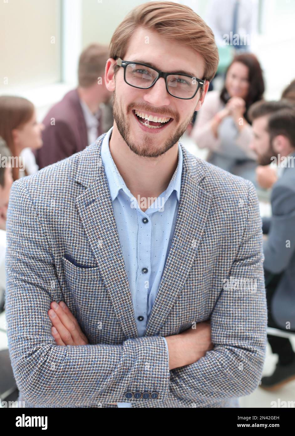 close up. smiling business man on the background of the office Stock ...