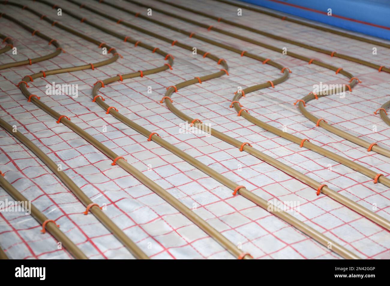 Installation of underfloor heating system in building Stock Photo - Alamy