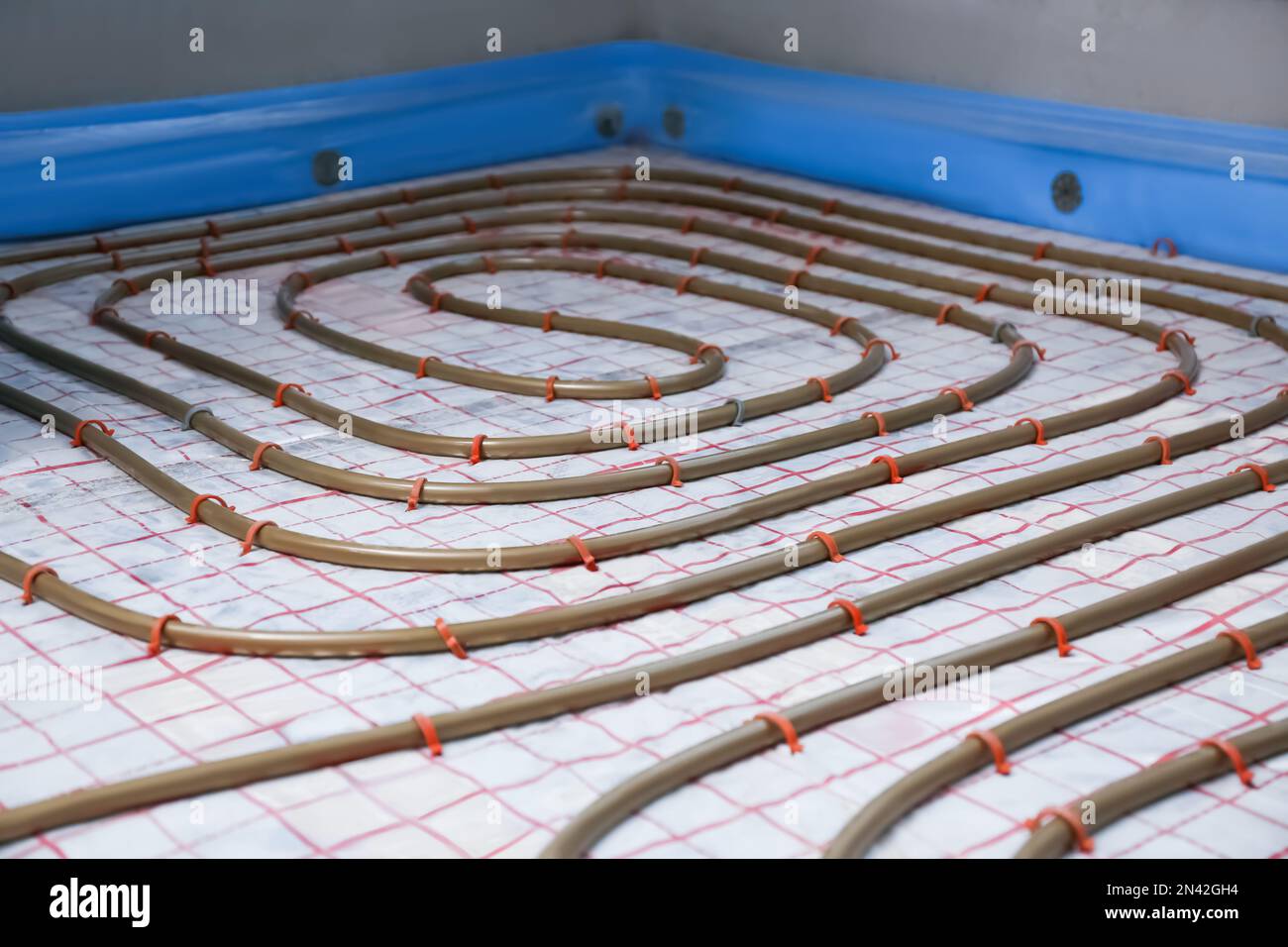 Installation of underfloor heating system in building Stock Photo - Alamy