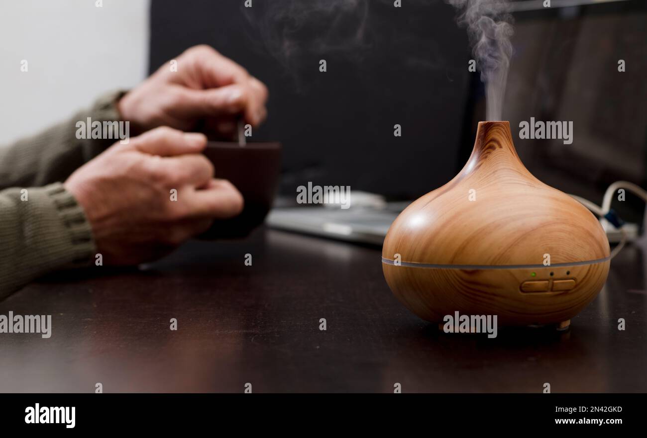 wood fragrance on desk table with steam essence of natural oils Stock ...