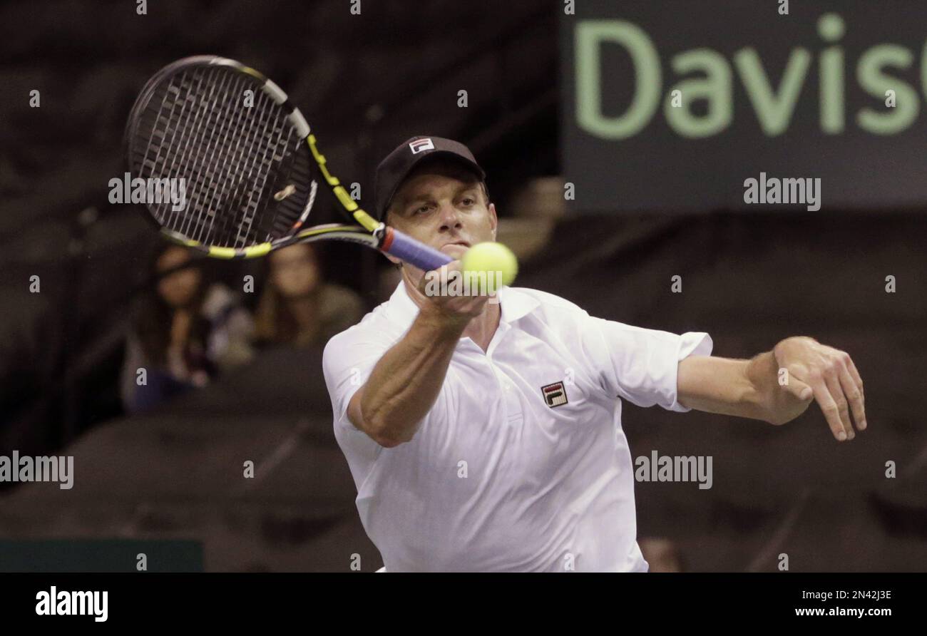 Sam Querrey, of the United States, returns a shot from Norbert Gombos ...