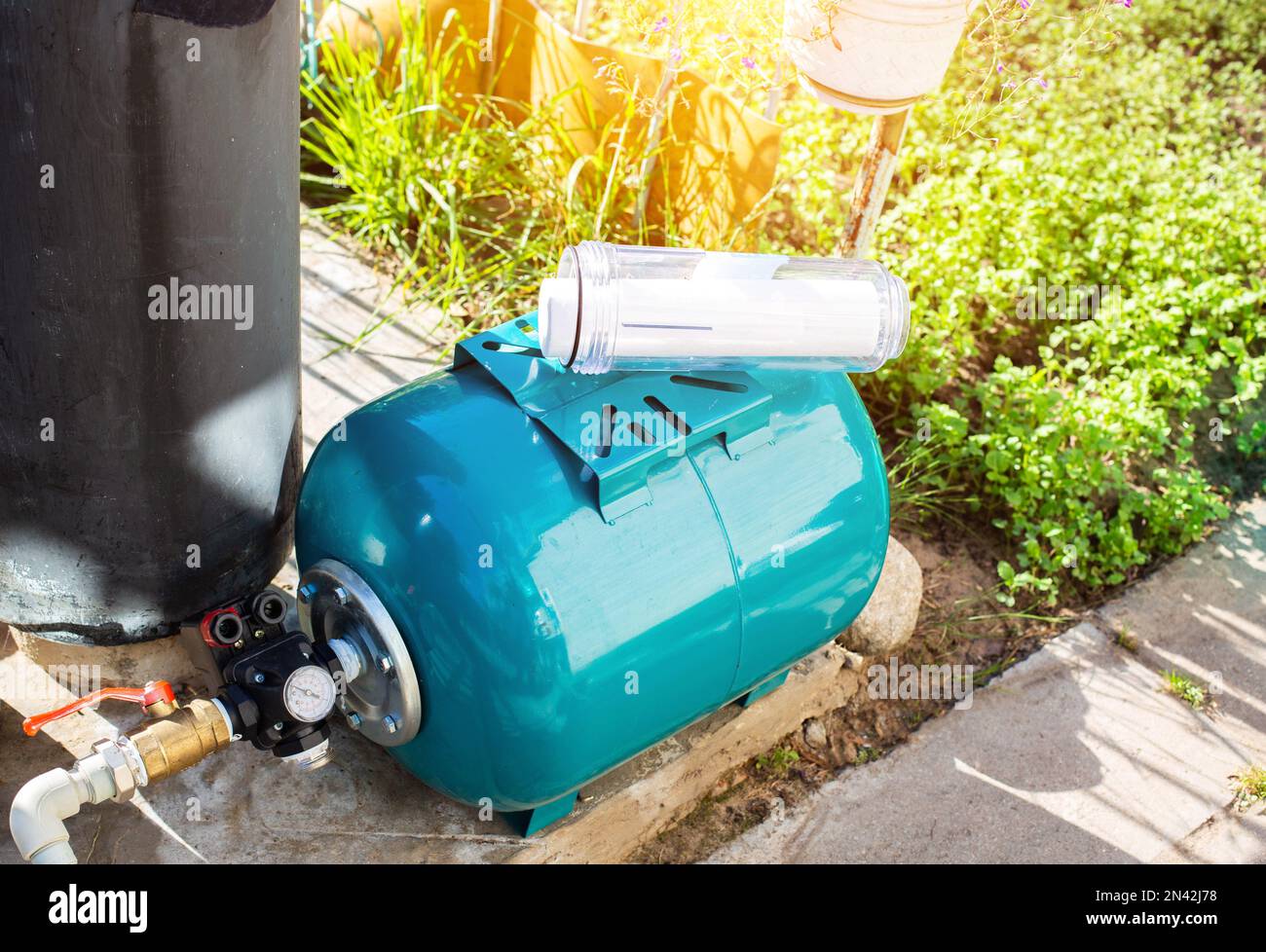 Water supply system from a well in a country house. New water filter ...