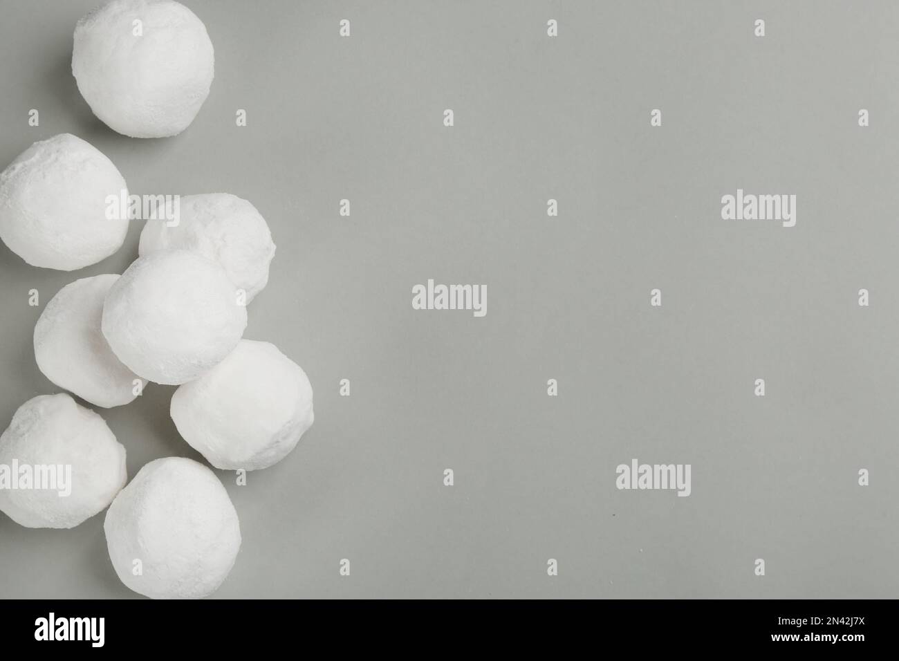 Snowballs on grey background, flat lay. Space for text Stock Photo - Alamy