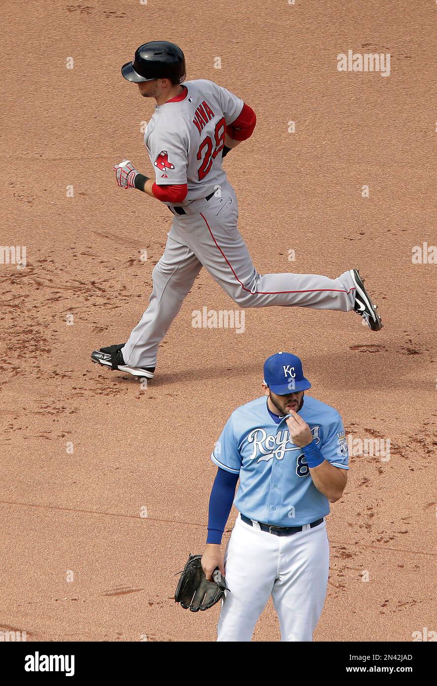 Boston Red Sox's Daniel Nava runs past Kansas City Royals third baseman ...